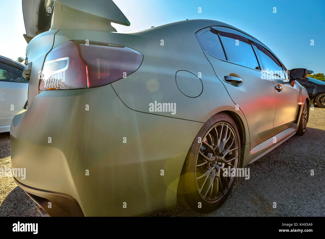 Rear side of a flat matte green car. Custom cars in Southern California ...