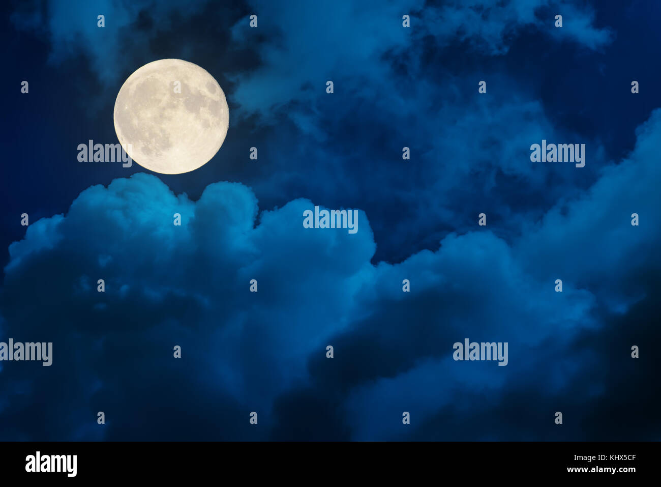 supermoon in dramatic clouds Stock Photo - Alamy