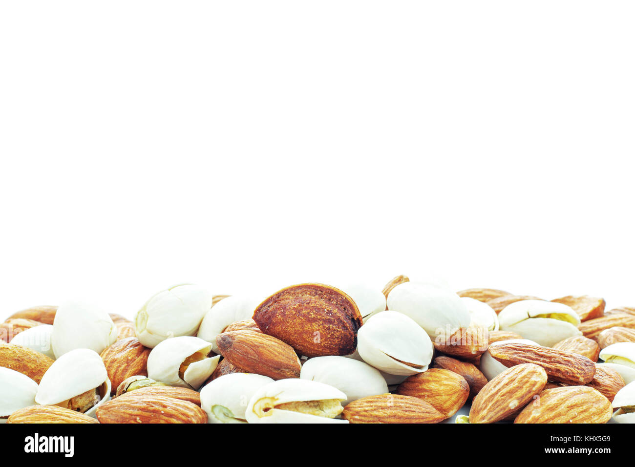Many almonds on a white background Stock Photo - Alamy