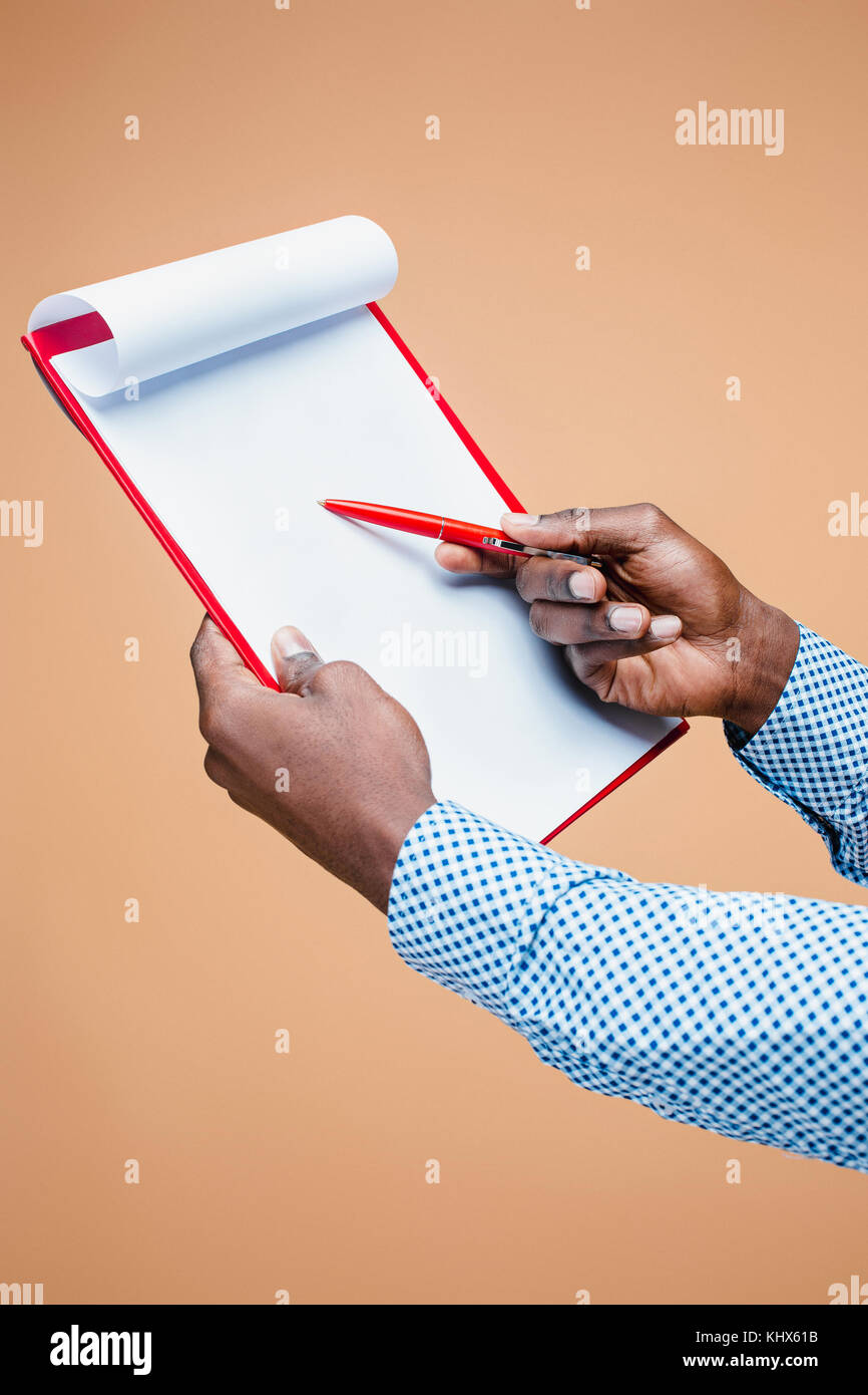 Male hand holding pen, isolated Stock Photo - Alamy