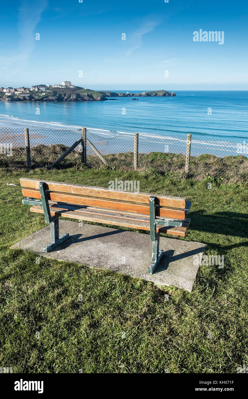 An empty bench seat overlooking Newquay Bay at Barrowfields in Newquay ...