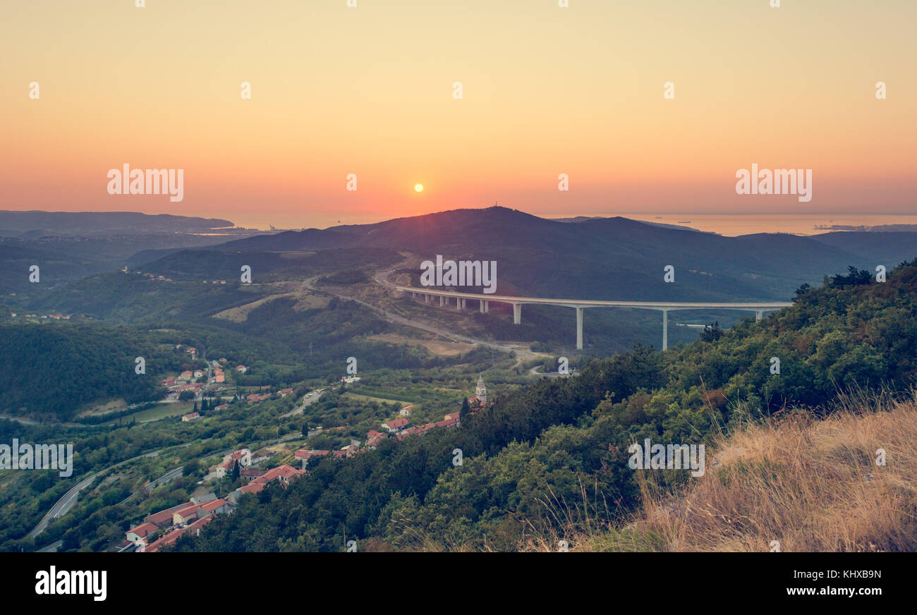 Long highway viaduct at sunset Stock Photo - Alamy