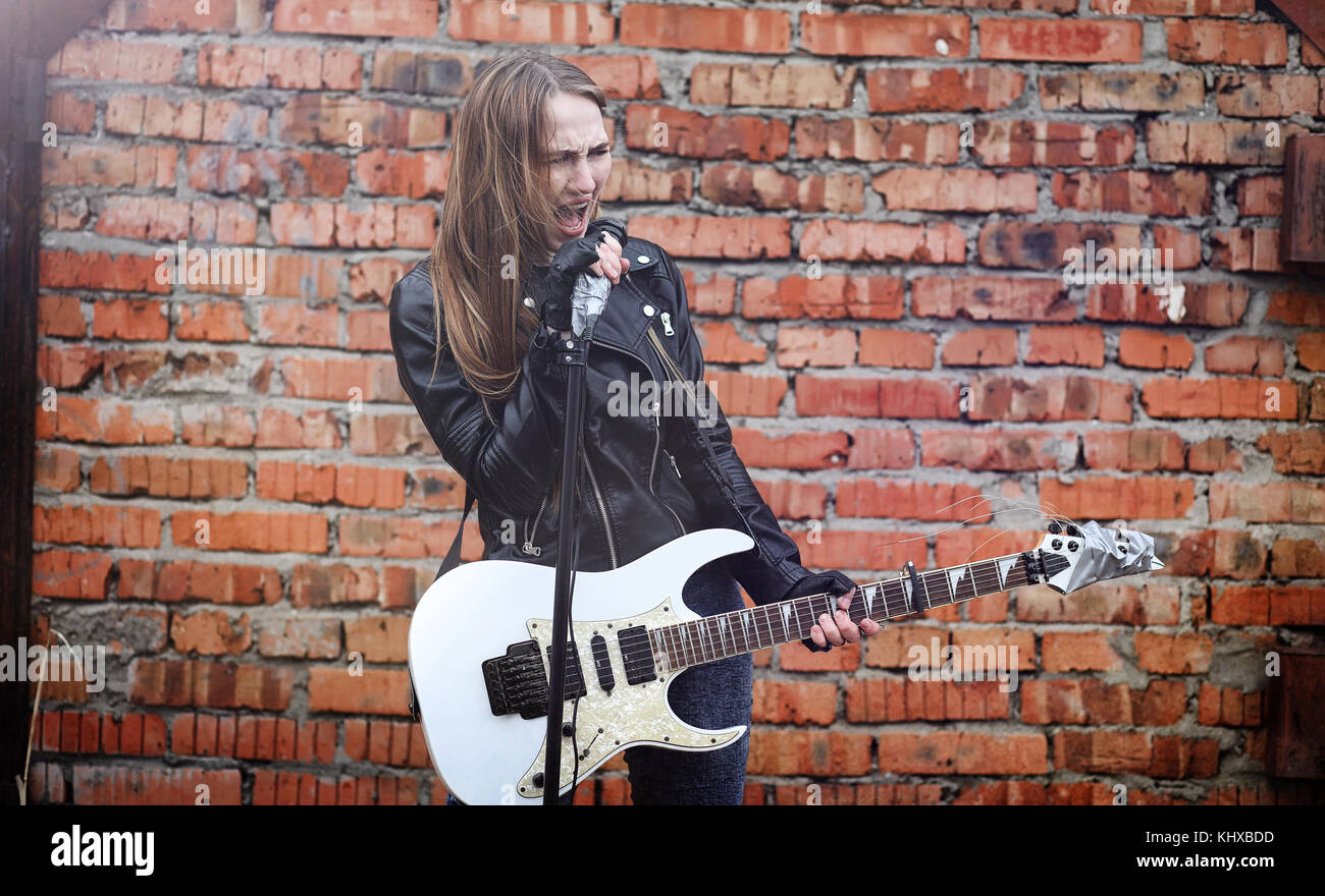 Beautiful young girl rocker with electric guitar. A rock musicia Stock ...