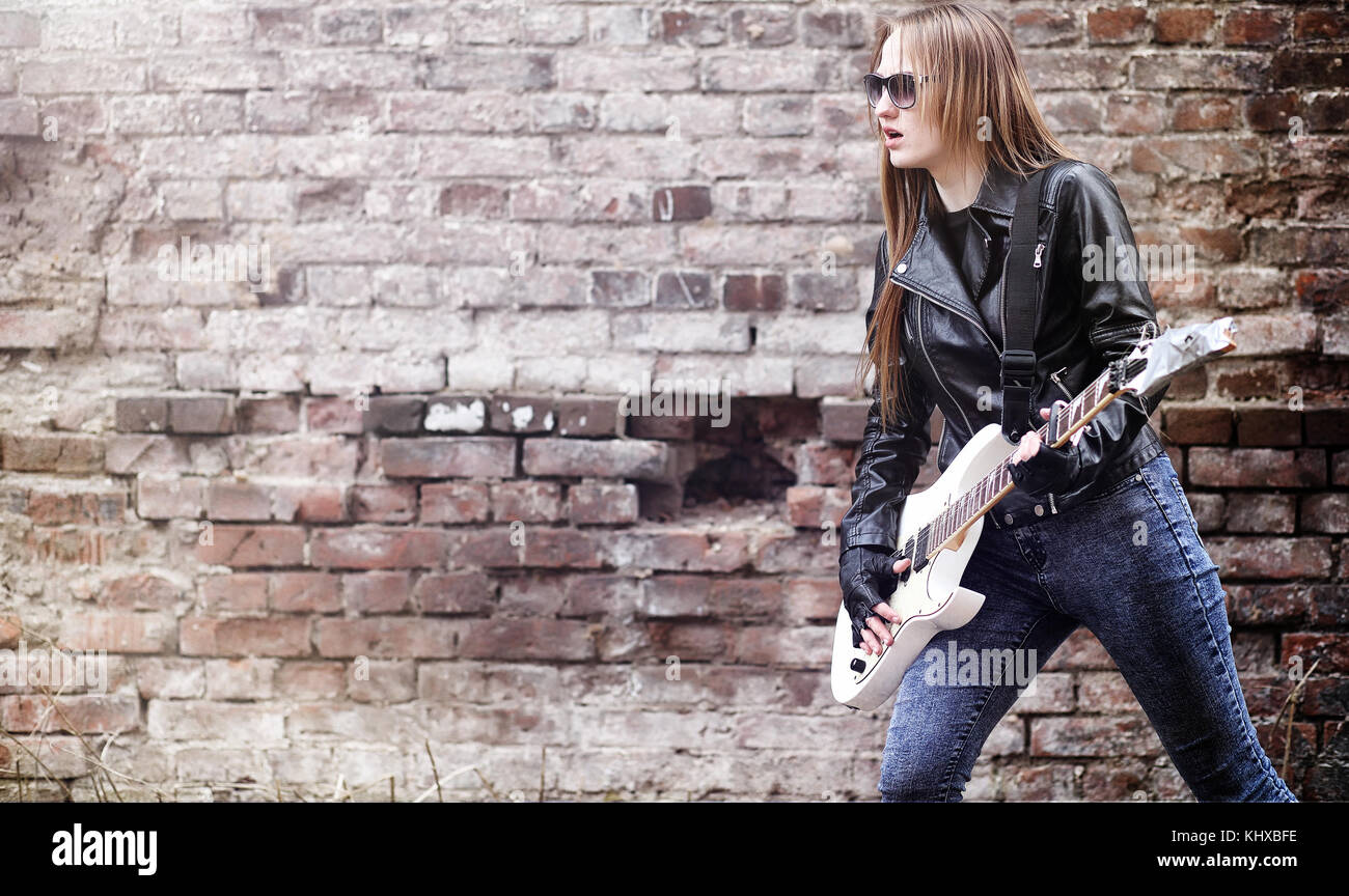 Beautiful young girl rocker with electric guitar. A rock musicia Stock ...