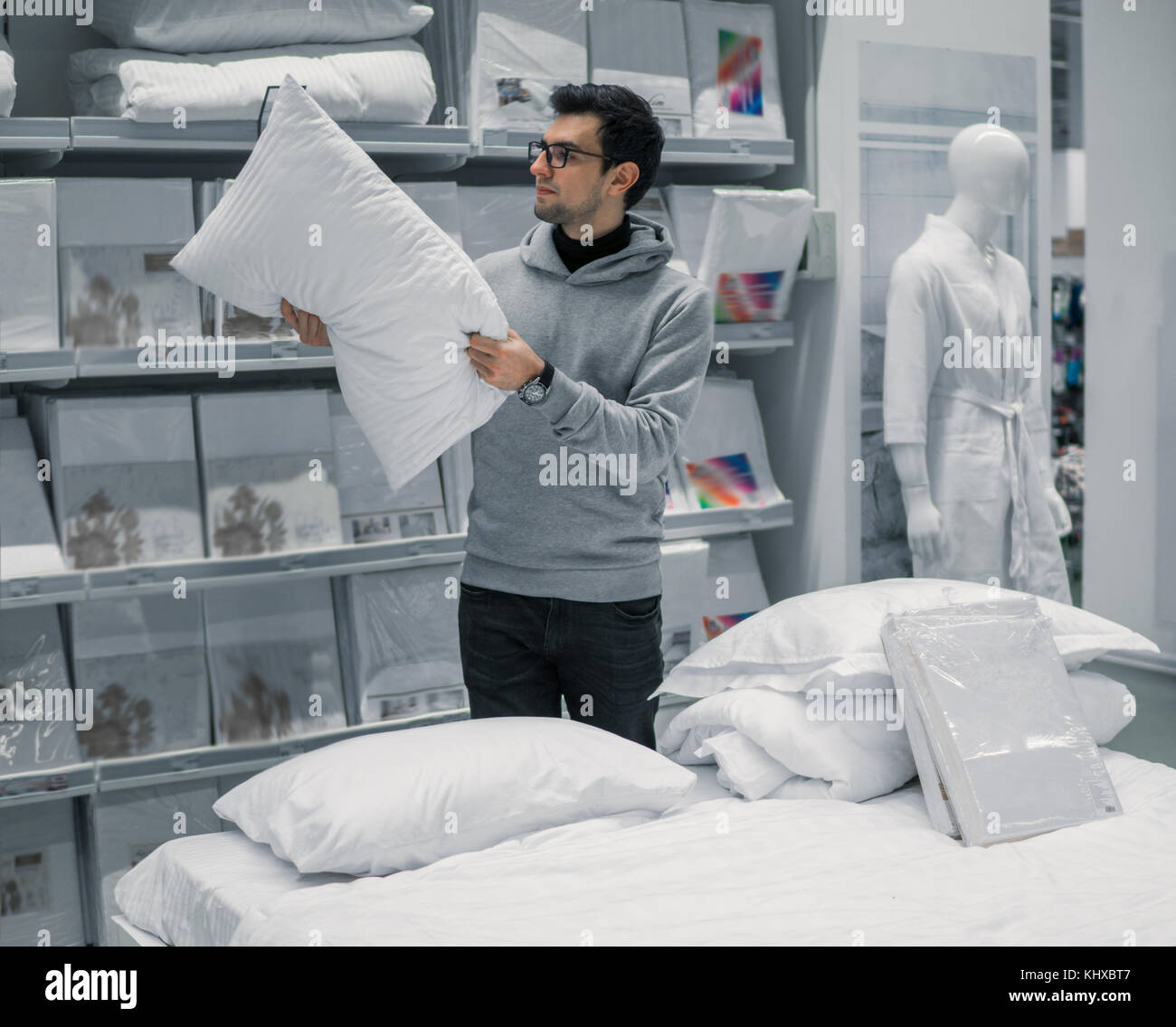 Customer man chooses bed linen in the supermarket mall store Stock ...