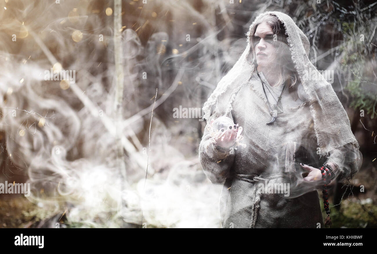 Fairy magician. A sorcerer with a glass sphere, a magical spell Stock ...