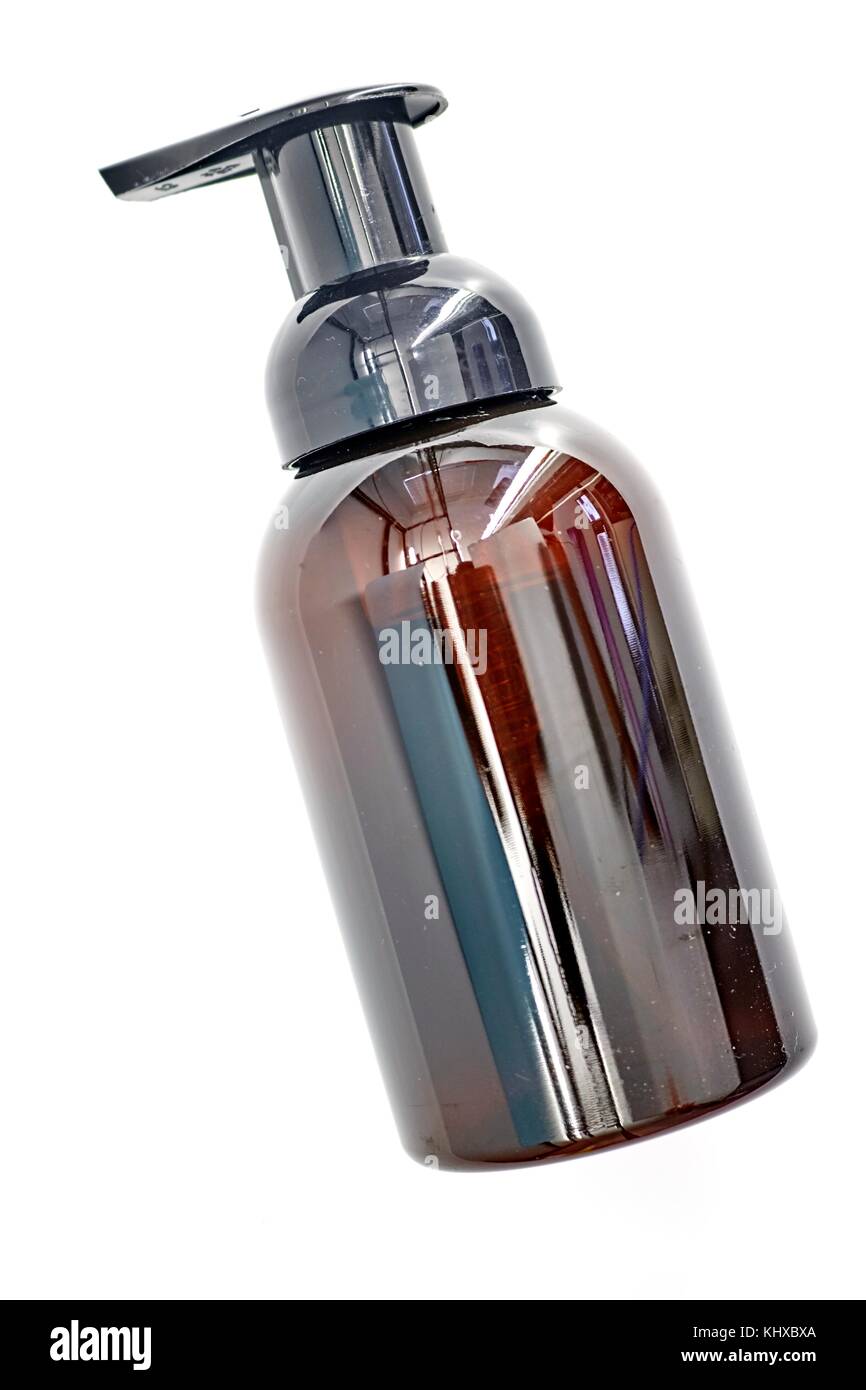 Dispenser bottle pouring liquid Cut Out Stock Images & Pictures - Alamy