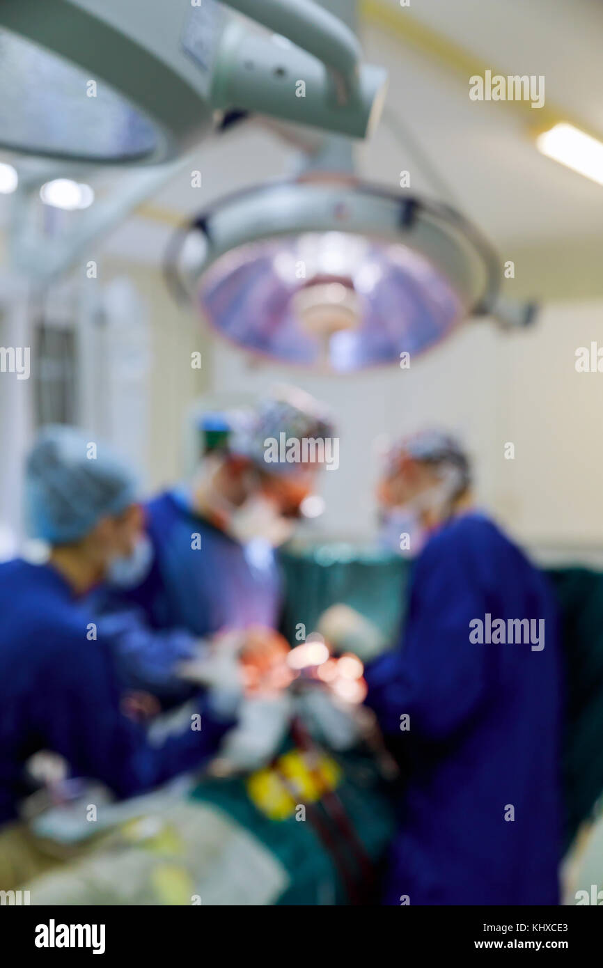 soft focus in the surgical operating room Surgeon hands the open heart ...