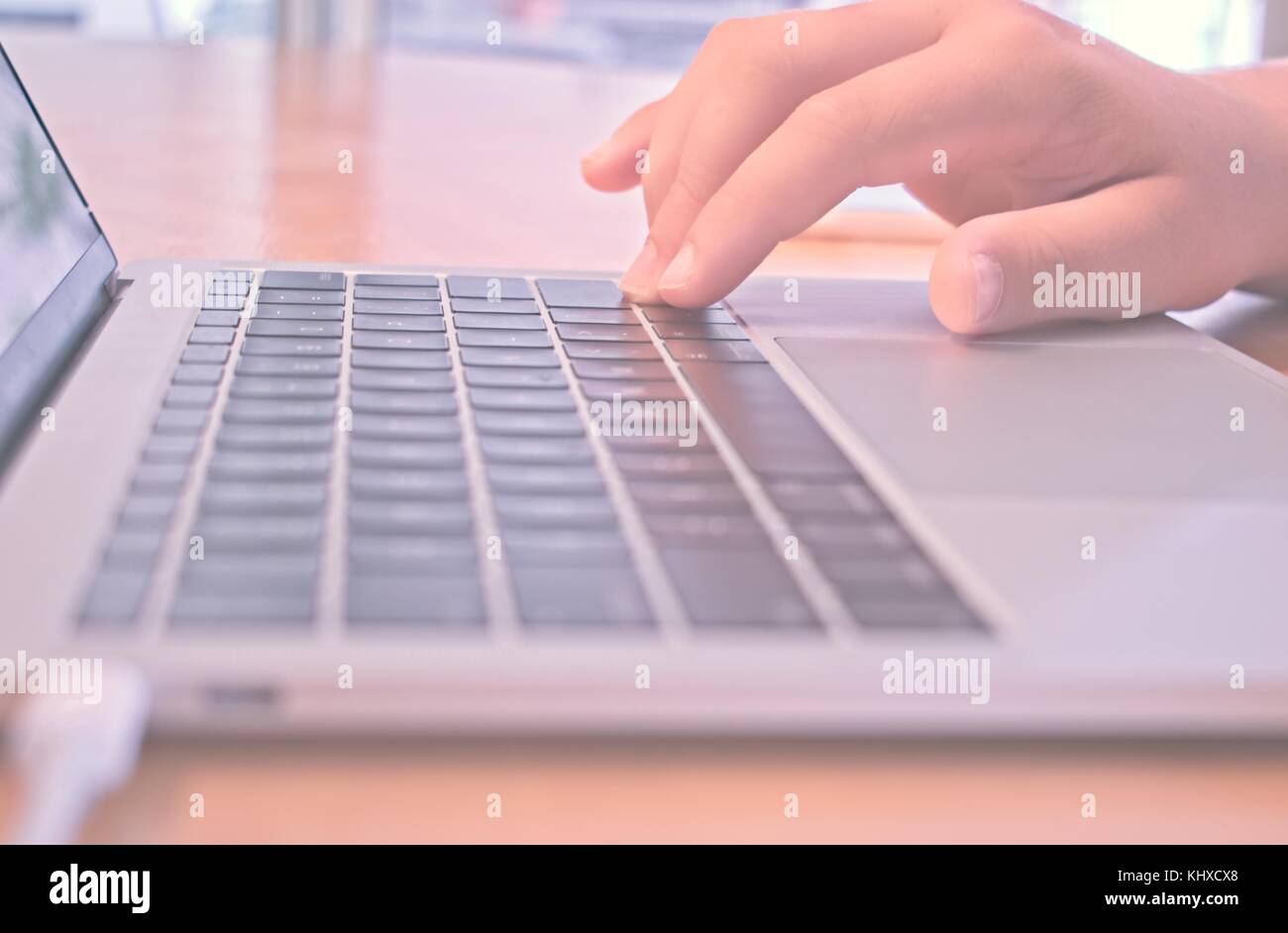 Teenager’s hand using laptop computer Stock Photo - Alamy