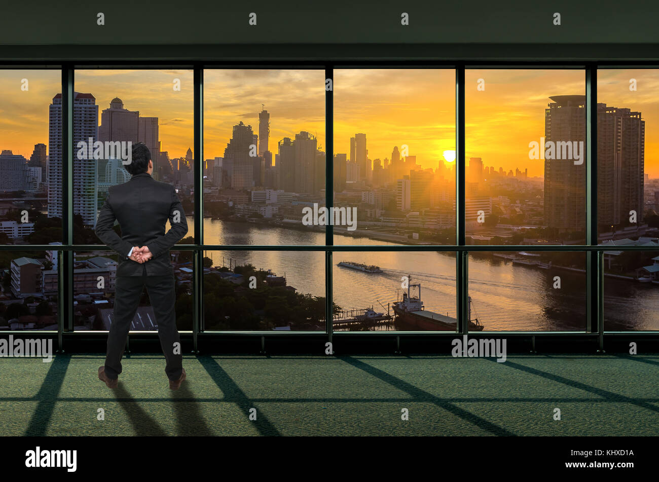 Back side of Businessman looking silhouette Bangkok cityscape at ...