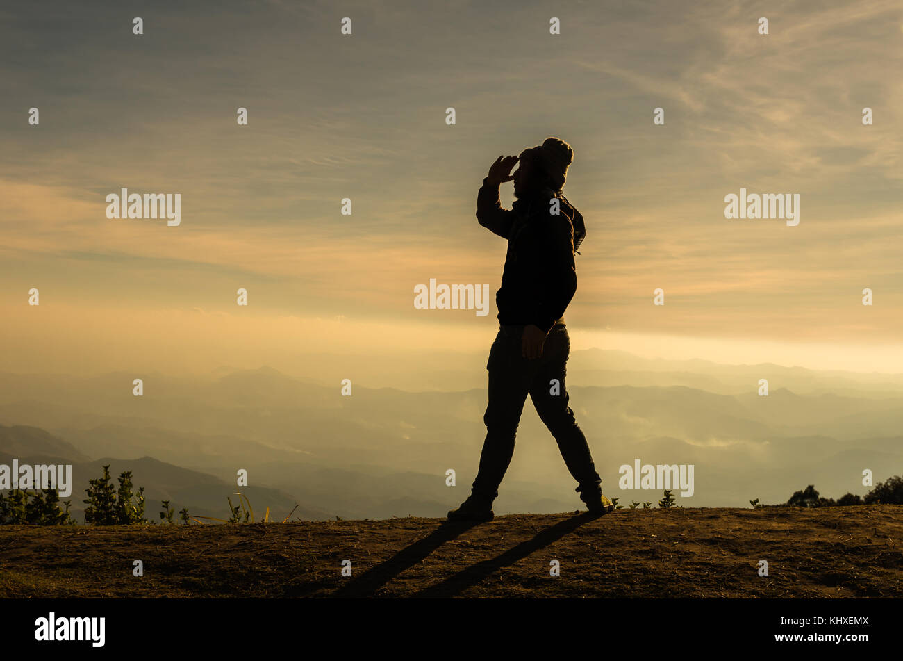 silhouette of a man who looking over the mountains landscape Stock ...