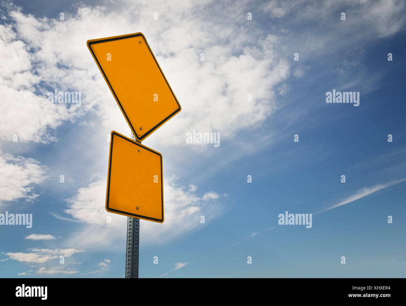 Empty yellow roadsign against blue skies with white clouds Stock Photo ...