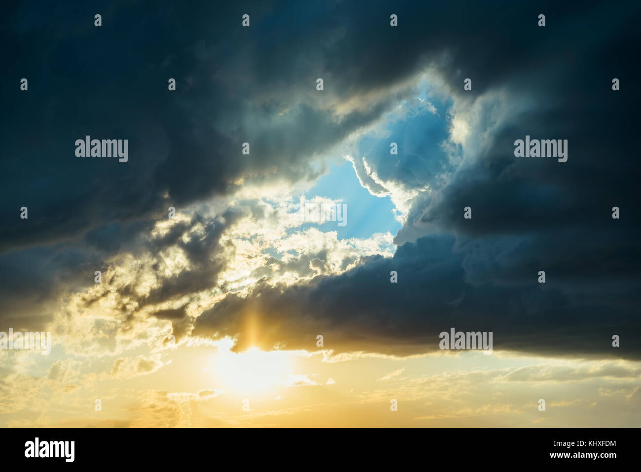 sun in dark clouds Stock Photo - Alamy