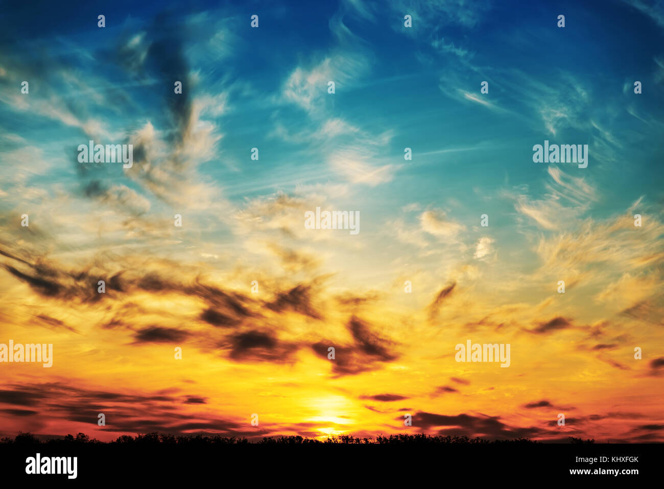 last rays of the sun in dramatic sky Stock Photo - Alamy