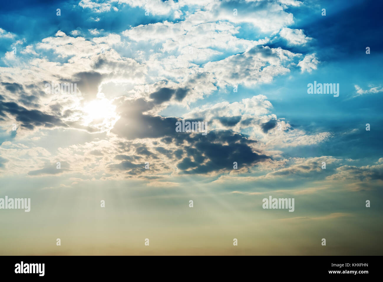 sun in dark clouds Stock Photo - Alamy