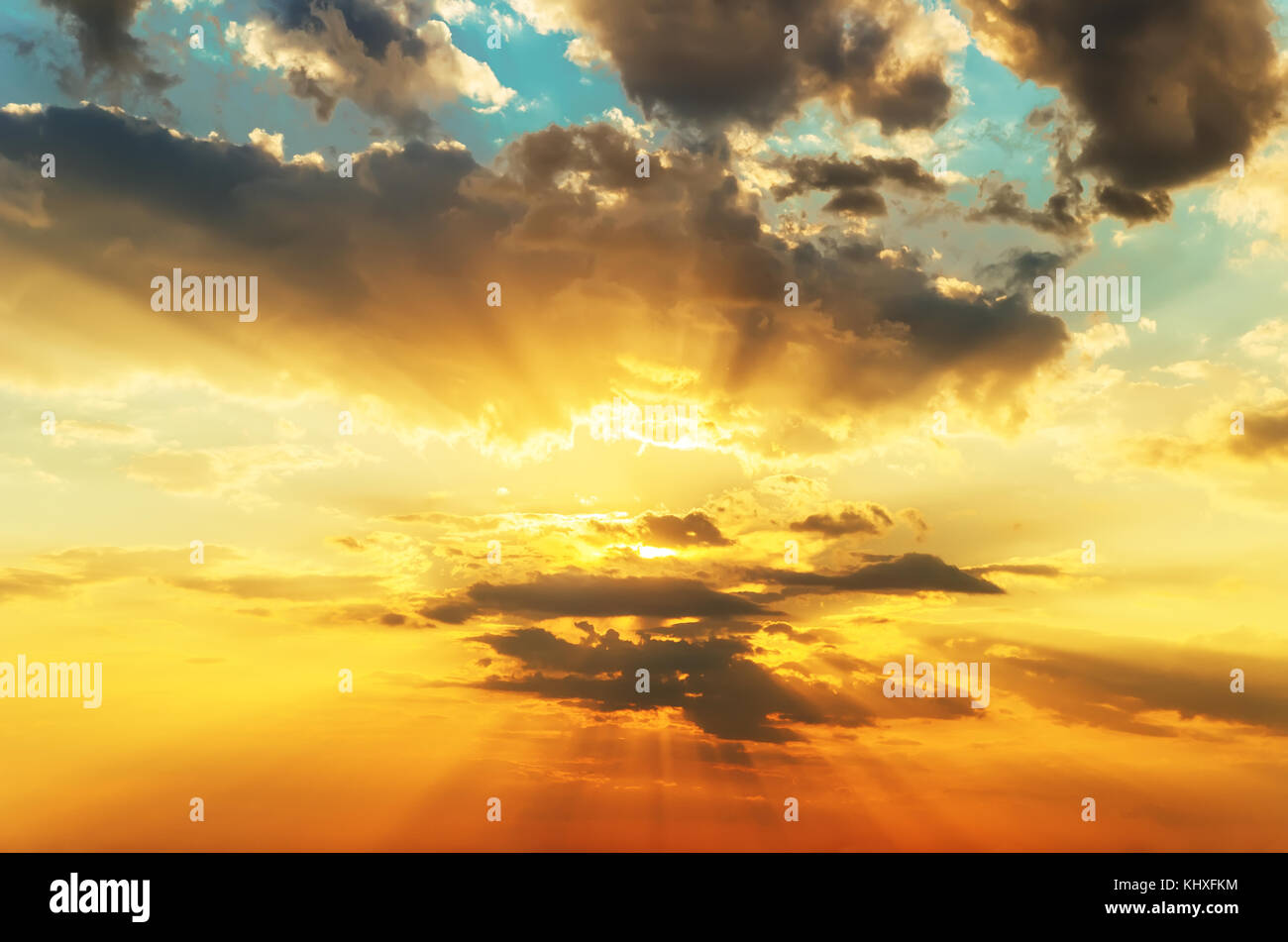 orange sunset in dramatic clouds Stock Photo - Alamy