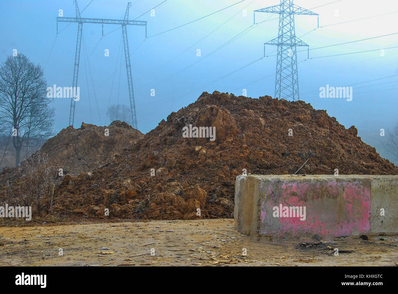 Large heaps of land from the pit for road construction, protective ...