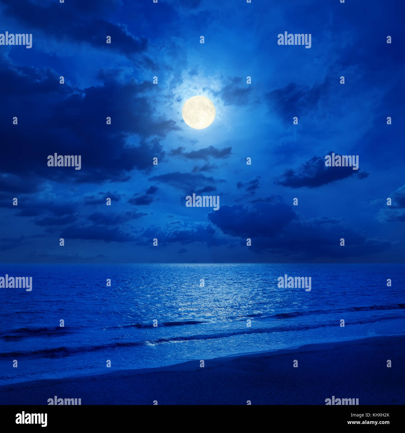 full moon in cloudy sky and sea with reflections Stock Photo - Alamy
