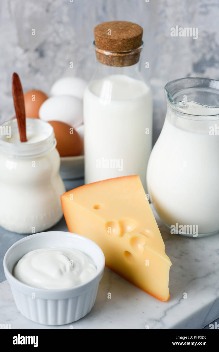Dairy products selection on concrete background. Eggs, Cheese, Milk ...
