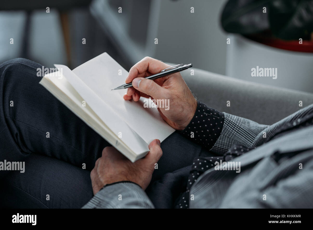 businessman taking notes in notebook Stock Photo - Alamy