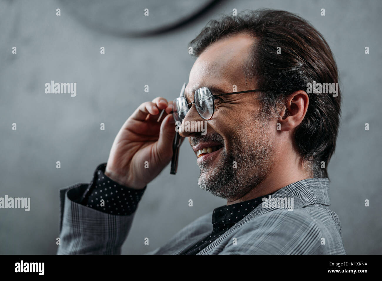 smiling businessman in eyeglasses Stock Photo - Alamy