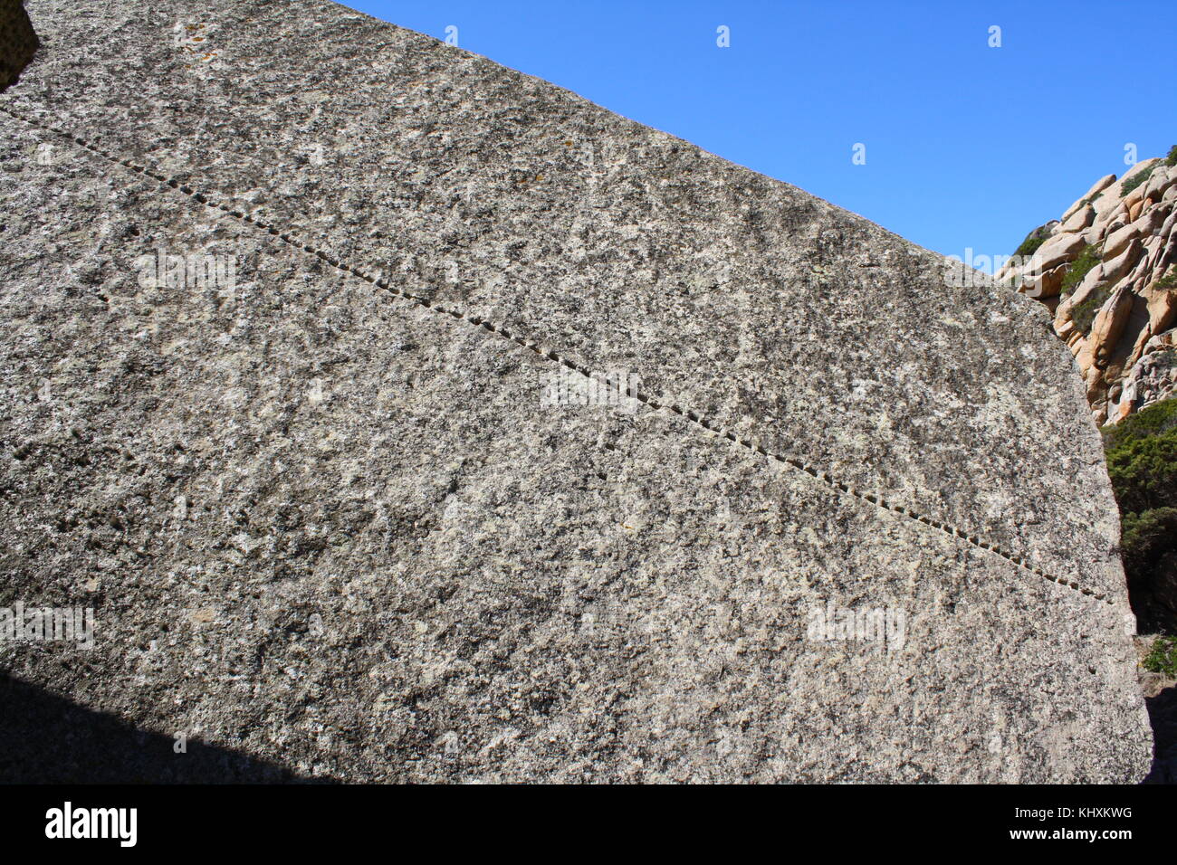 A big granite rock broken into several parts Stock Photo - Alamy