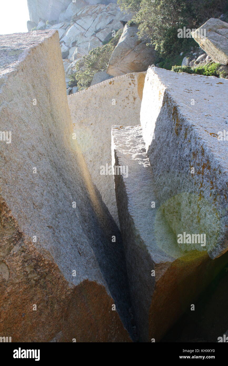 A big granite rock broken into several parts Stock Photo - Alamy