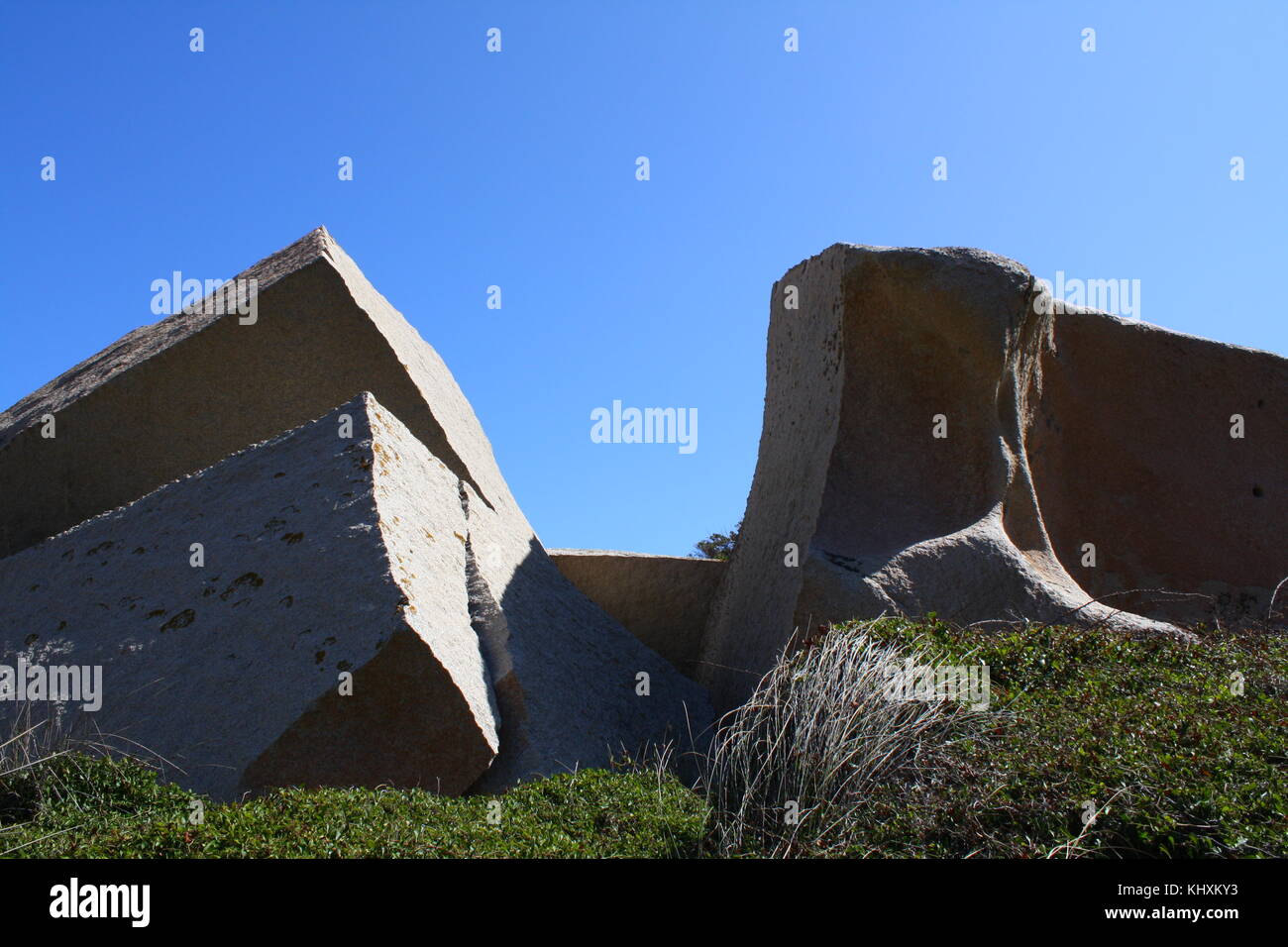 A big granite rock broken into several parts Stock Photo - Alamy