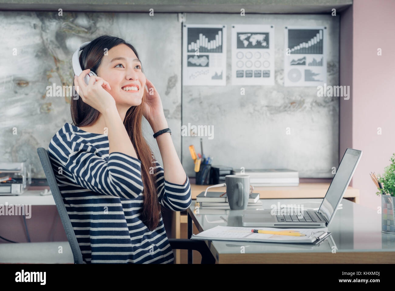 Young asian casual businesswoman arm on desk rest pose with laptop ...