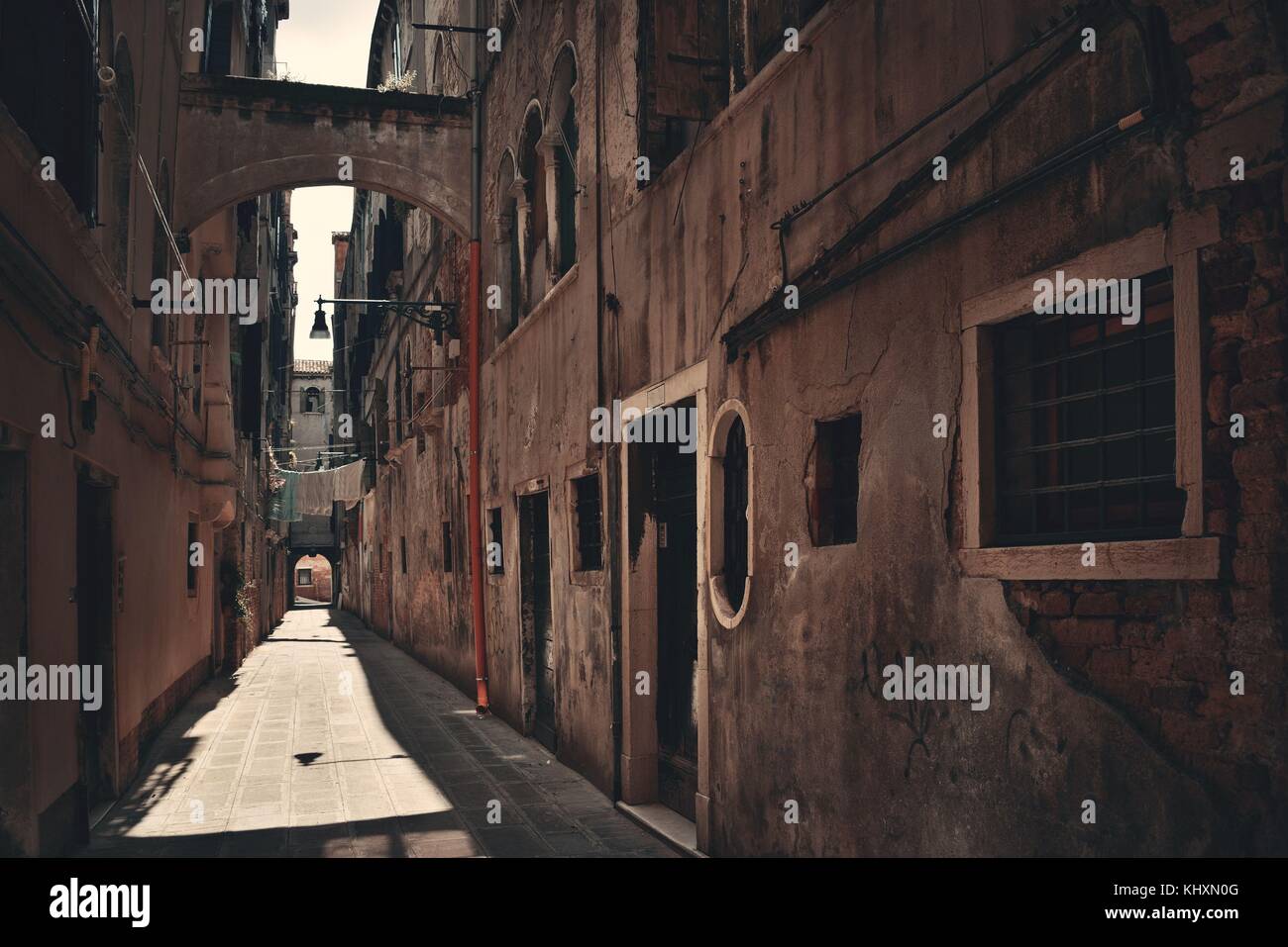 Alley view with arch and historical buildings in Venice, Italy Stock ...