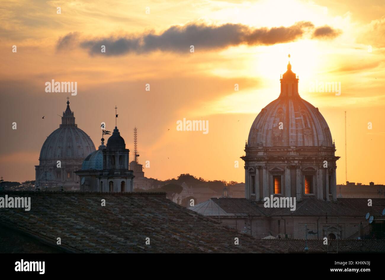 Sunset rooftop view with domes in Rome, Italy Stock Photo - Alamy