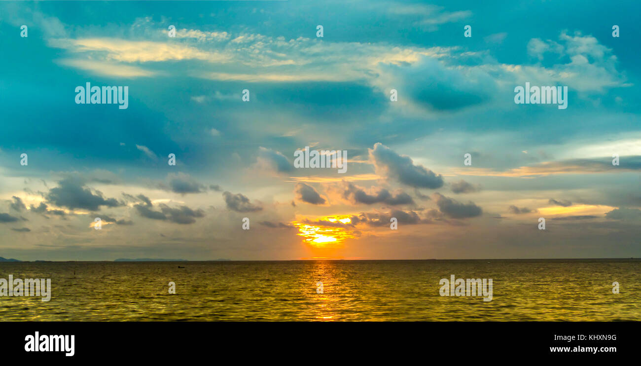 last light of panorama sunset on horizon line over sea in the evening ...