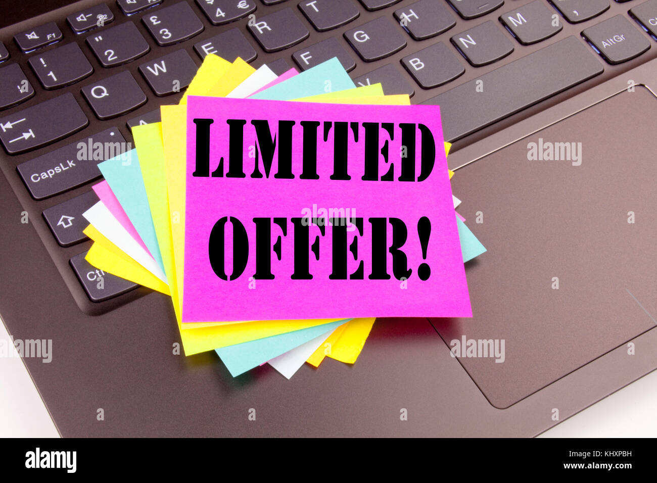 Writing Limited Offer text made in the office close-up on laptop ...
