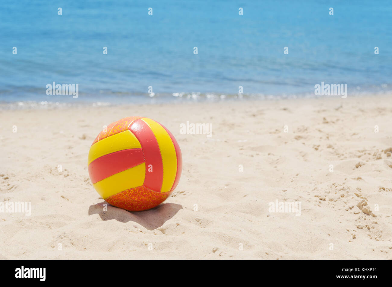 color ball on sand near sea Stock Photo - Alamy