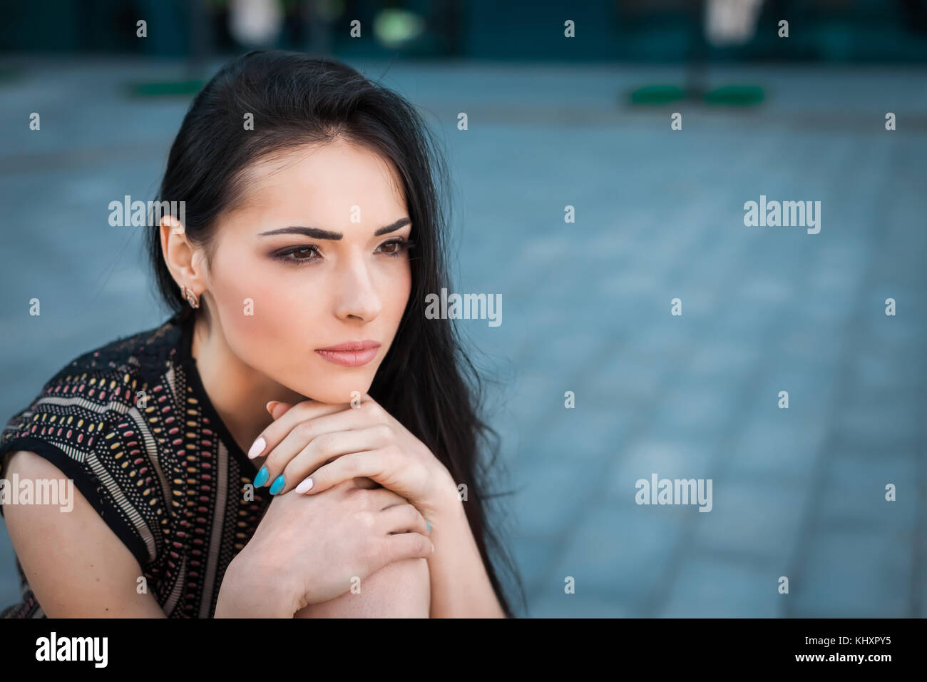 Beautiful girl sitting on curb hi-res stock photography and images - Alamy
