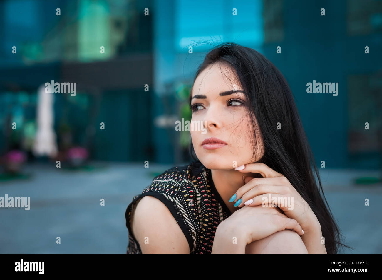 Beautiful girl sitting on curb hi-res stock photography and images - Alamy