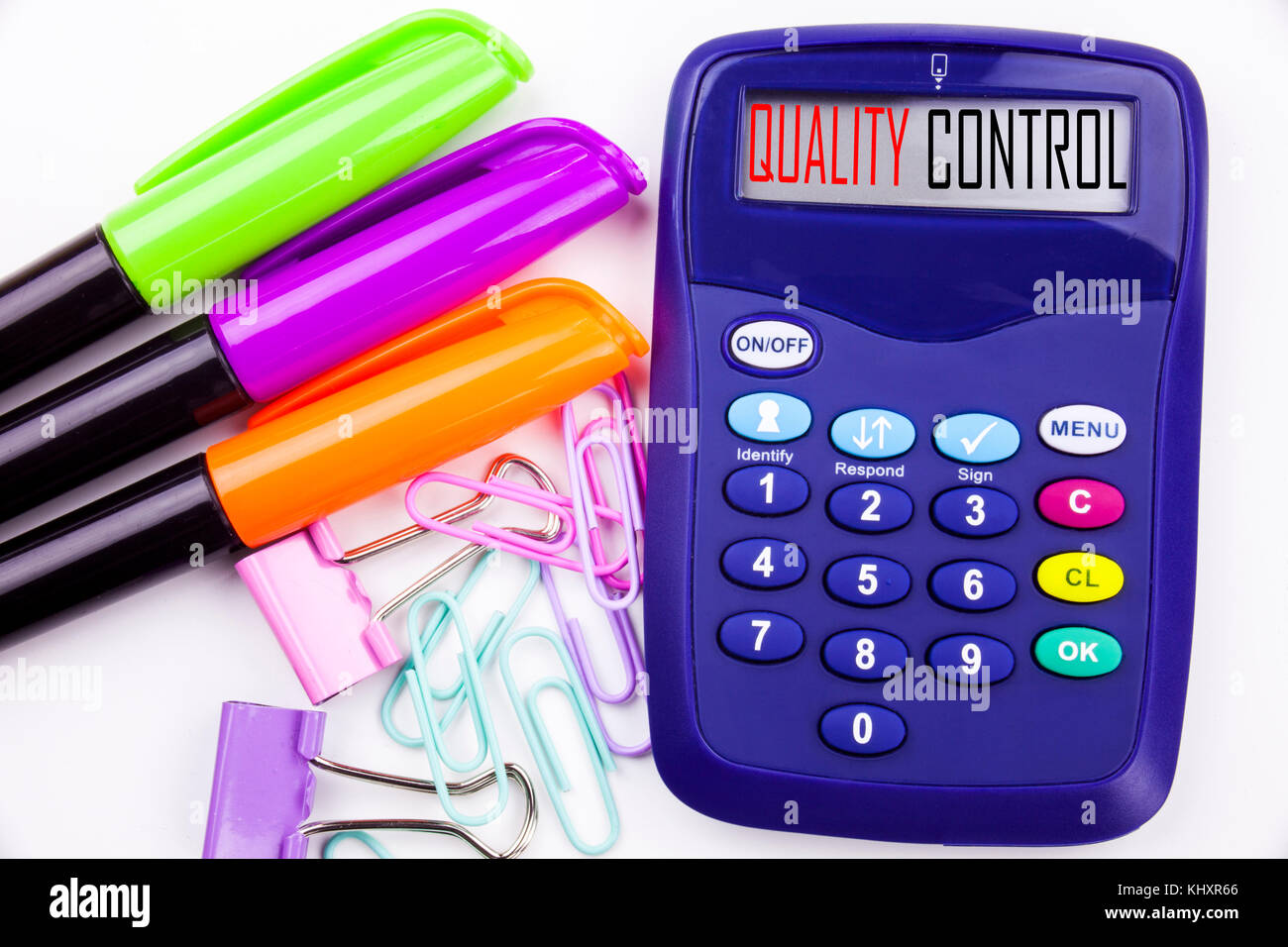 Writing word Quality Control text in the office with surroundings such ...