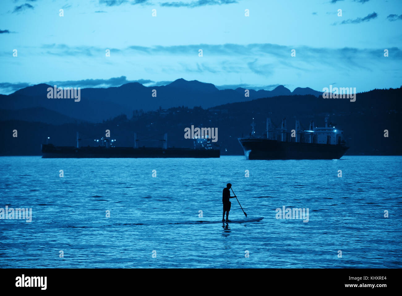 A man row boat in sea in Vancouver Stock Photo - Alamy