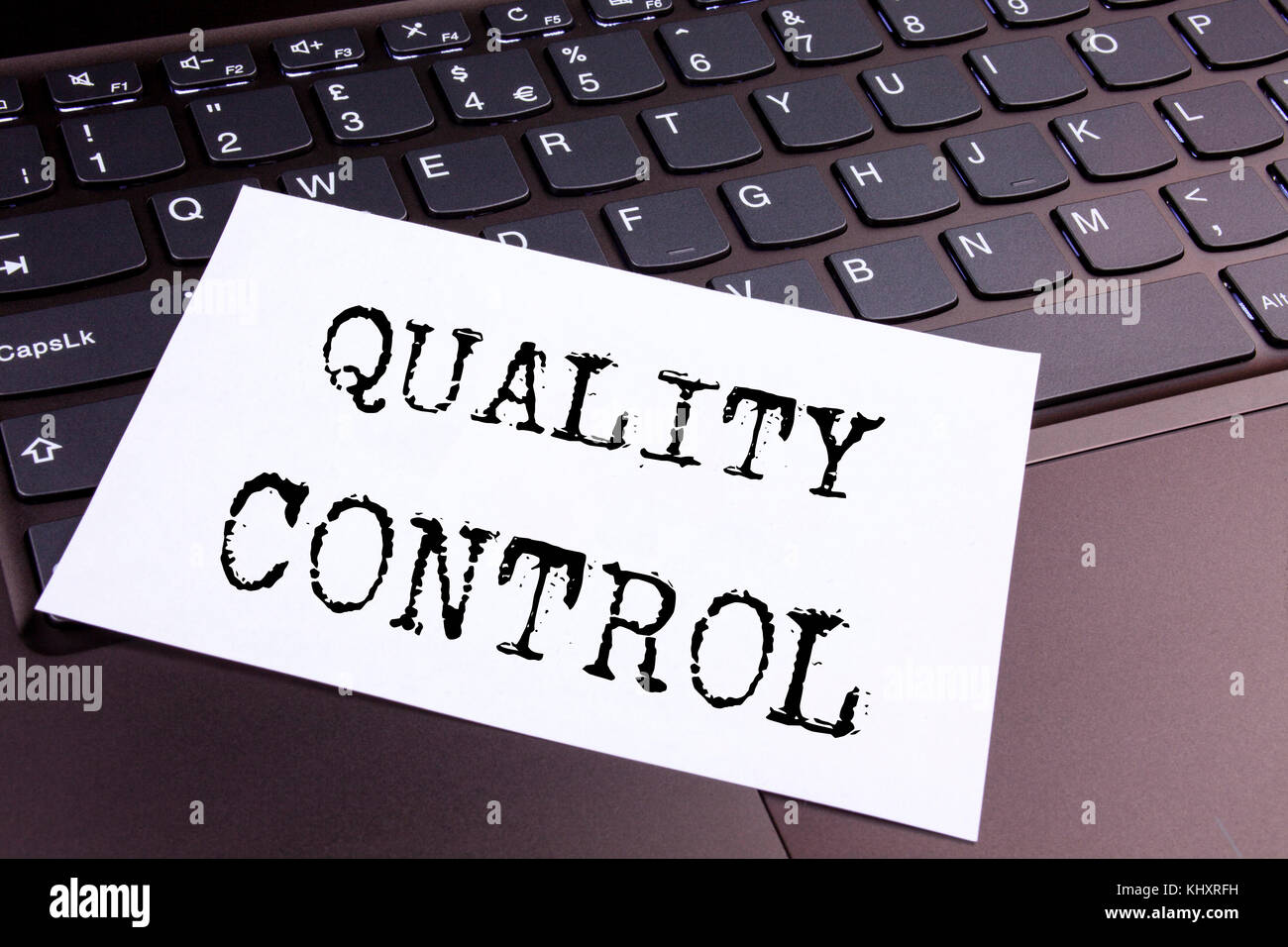 Writing Quality Control text made in the office close-up on laptop ...