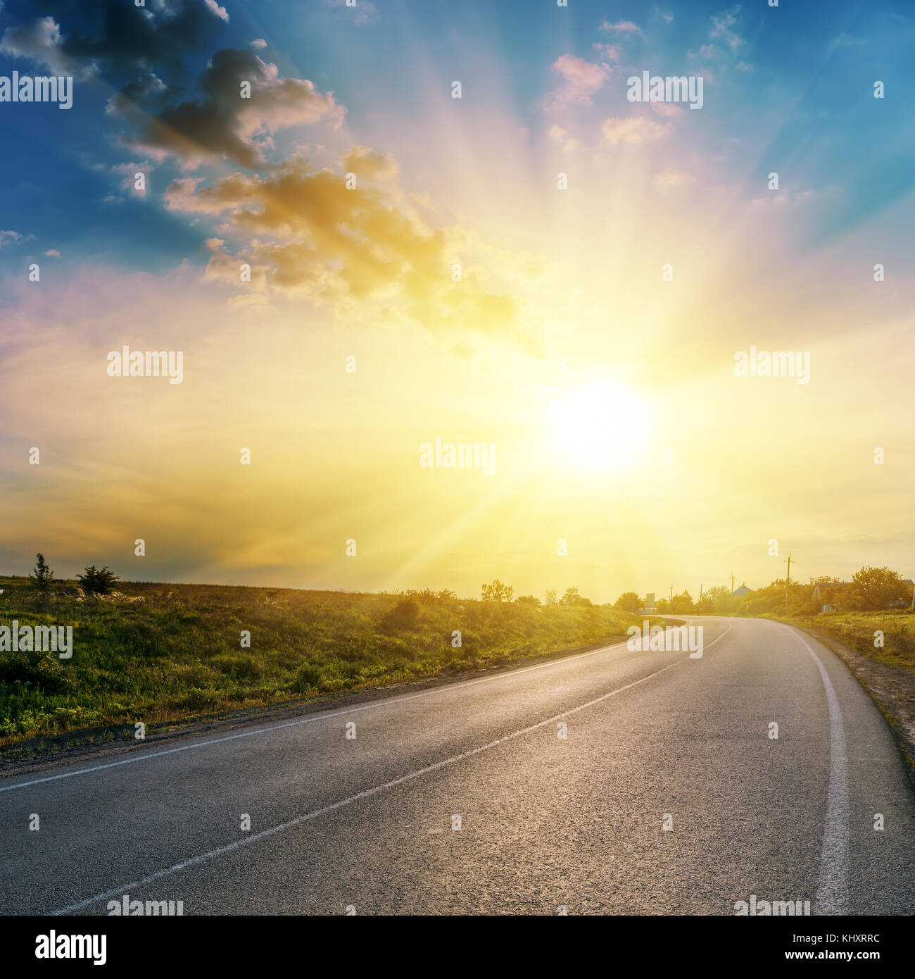 colored sunset over asphalt road Stock Photo - Alamy