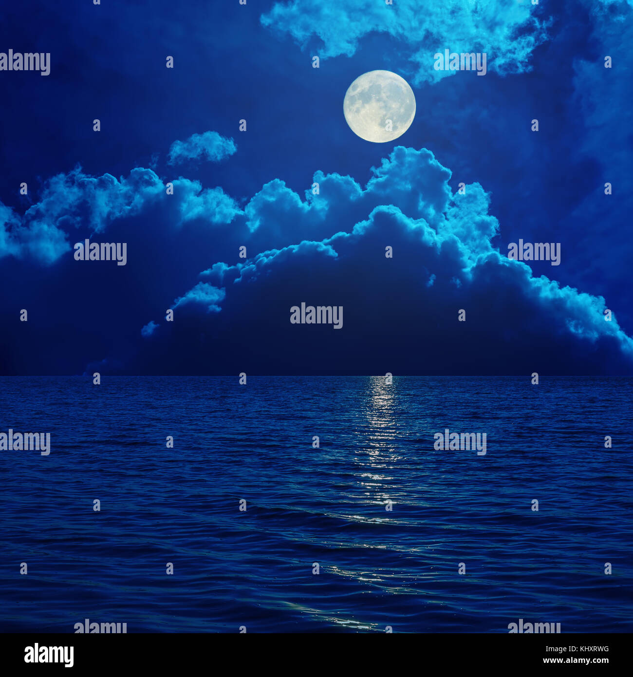 full moon in clouds over sea Stock Photo - Alamy