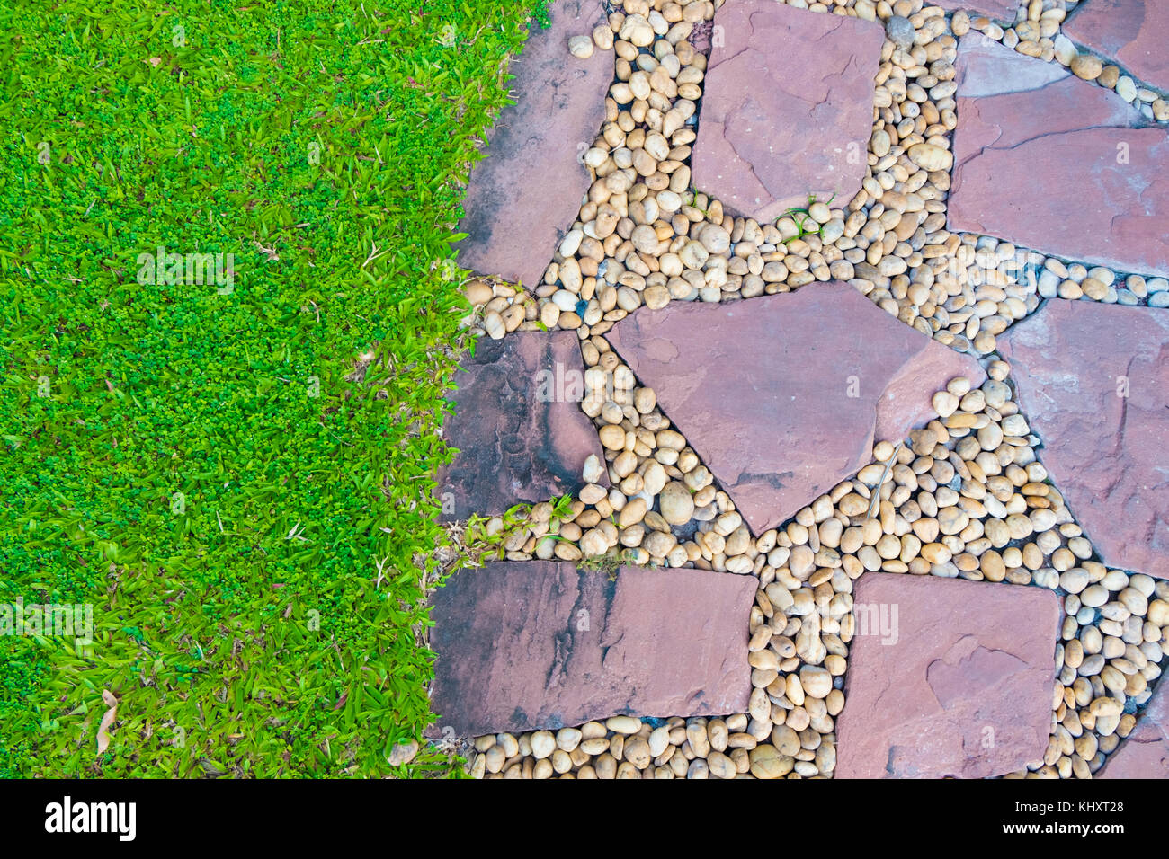 Green grass field with stone pathway and small rock decoration. nature ...