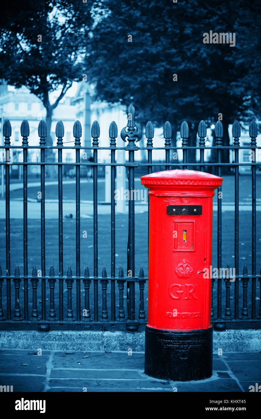 Red post box in street with historical architecture in London Stock ...