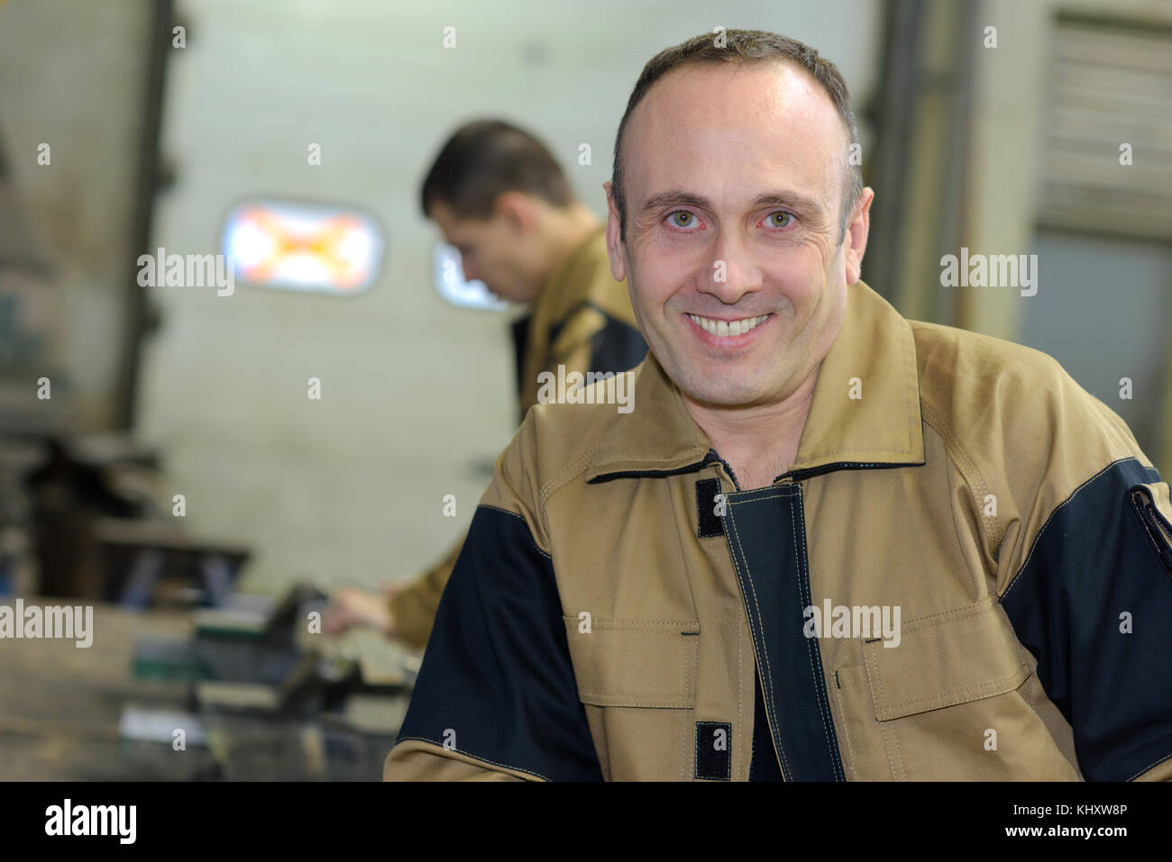 Portrait of male worker in uniform Stock Photo - Alamy