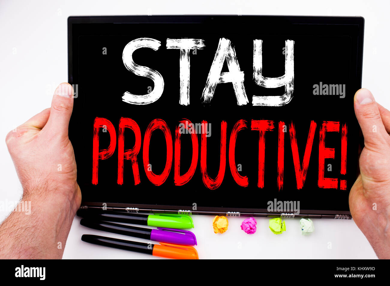 Stay Productive text written on tablet, computer in the office with ...