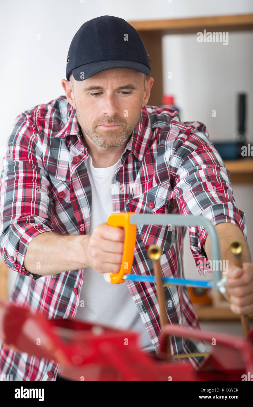 man cutting the copper insulation tubes Stock Photo - Alamy