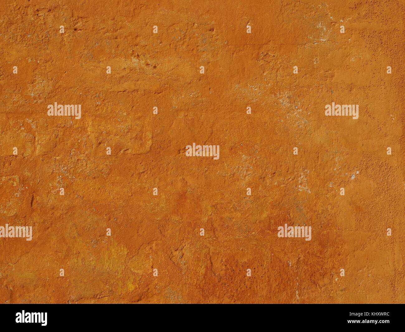 Textured blank ochre-painted wall as stylish background/backdrop Stock ...