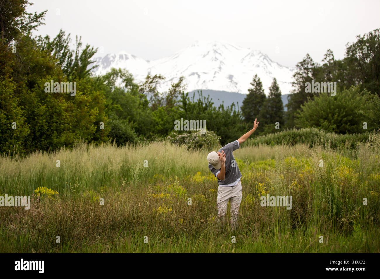 Teenage boy dancing in rural setting Stock Photo - Alamy