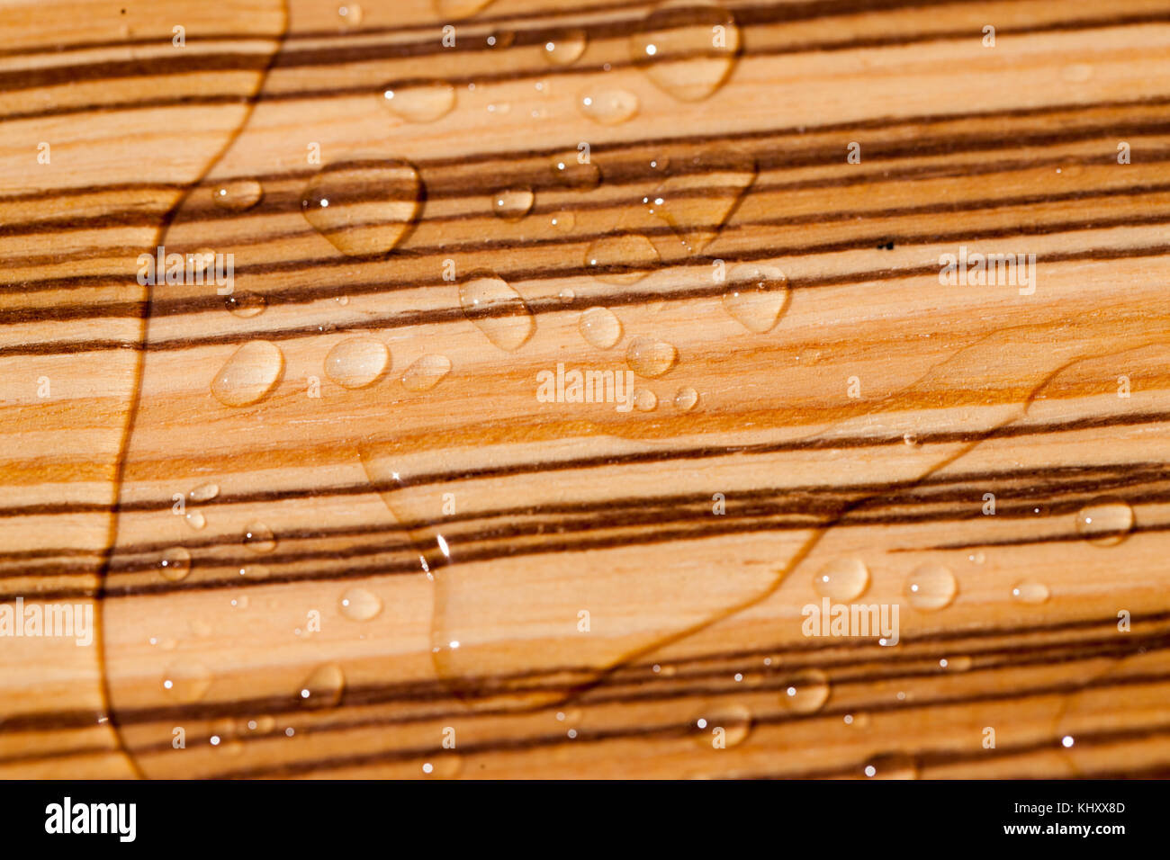 Water on wooden surface, close-up Stock Photo - Alamy