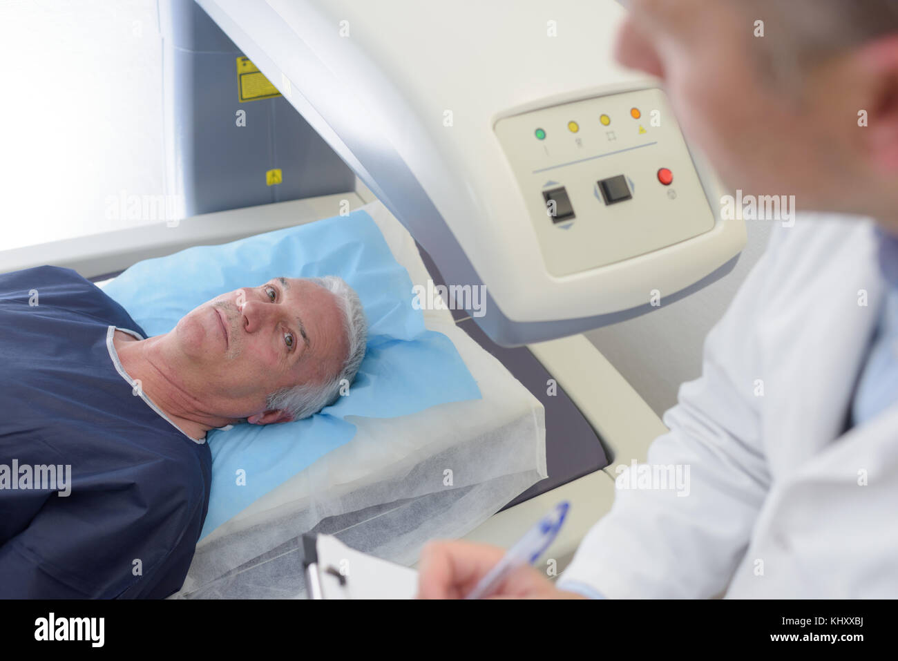 male patient ready to undergo mri assisted by doctor Stock Photo - Alamy